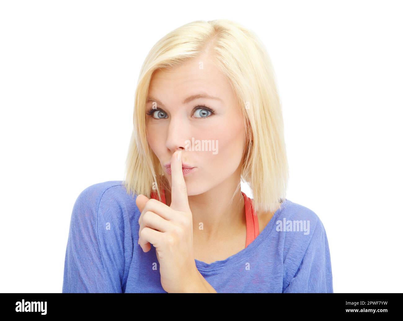Lets keep this a secret. A gorgeous young woman with her finger to her ...