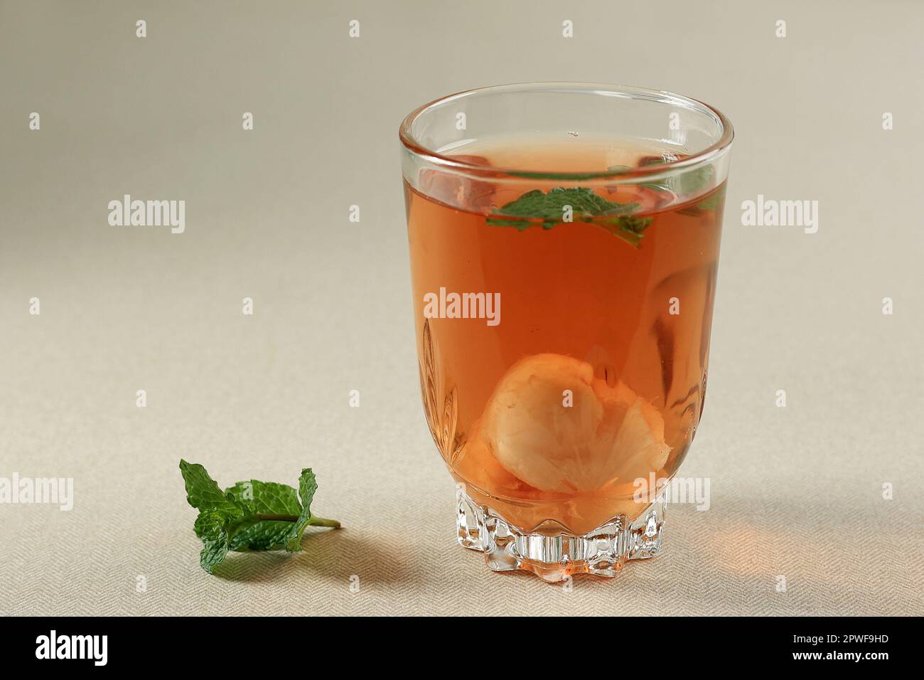 Lychee Tea, Sweet Tea with Canned Litchi and Mint Leaf. Copy Space for ...
