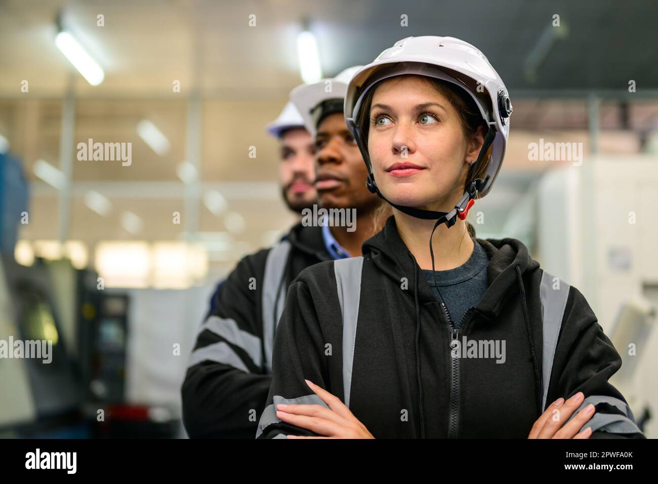 Portrait of technicians engineers team working at industrial factory ...