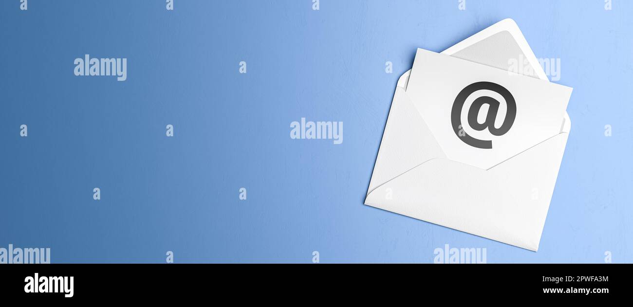 Letter with an at sign in an envelope on blue table background. Email ...