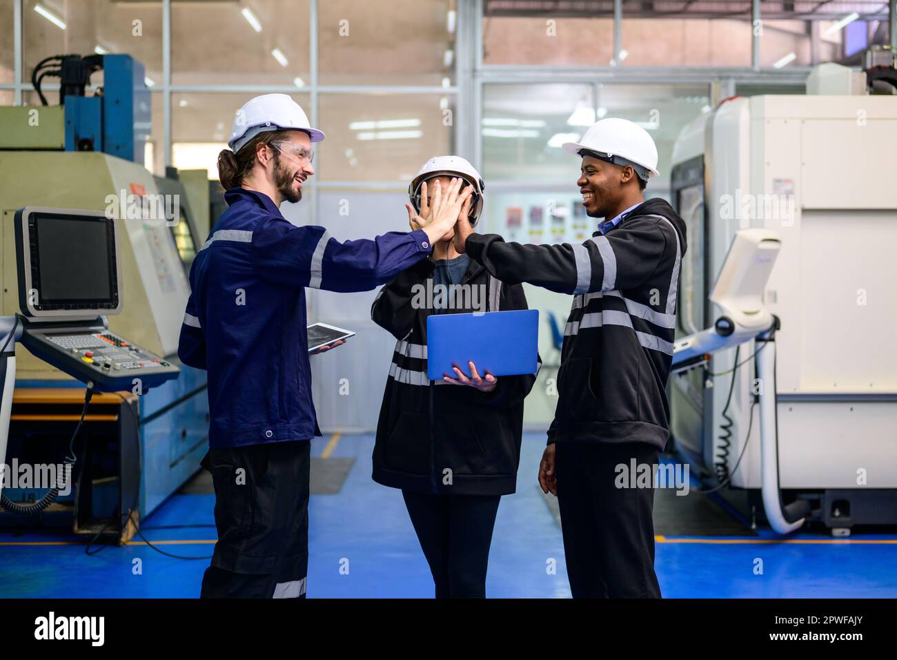 Group of technicians engineers team working at industrial factory Stock Photo - Alamy
