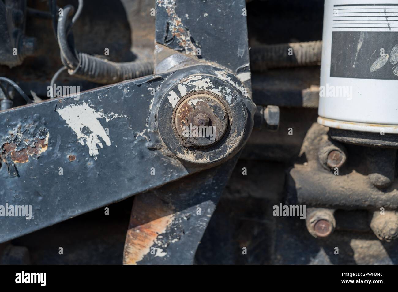 Detail of old tractor and mechanical pivot arm with grease zerk Stock ...