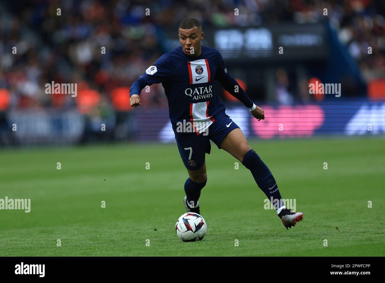 PSG's Kylian Mbappe runs with ball during the French League One soccer ...