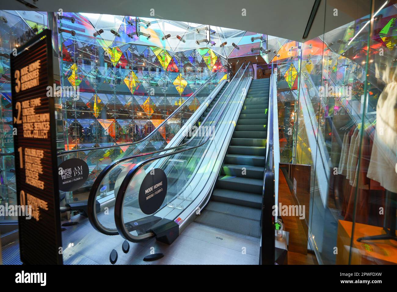 Paris, France - April 9, 2023 : Escalator in the atrium of the ...