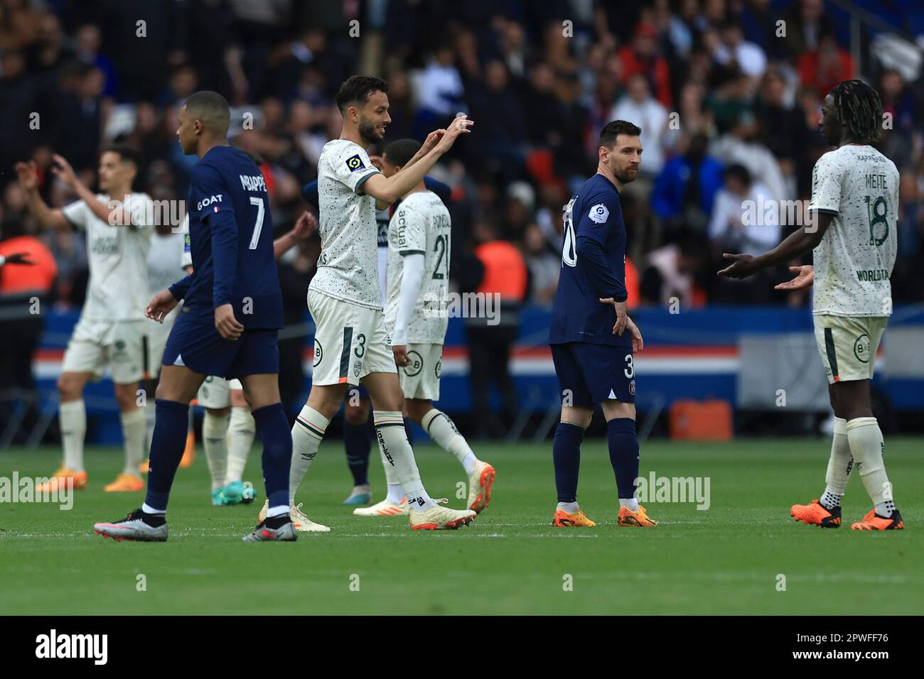 Lorient players celebrate their victory as PSG's Kylian Mbappe and PSG ...