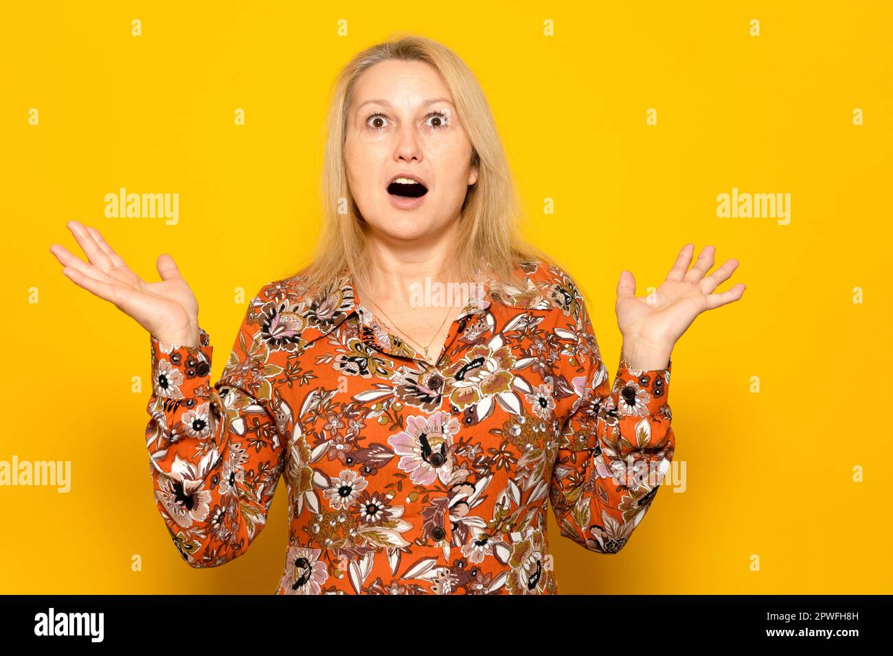 Surprised happy woman looking at camera with open mouth with excitement ...