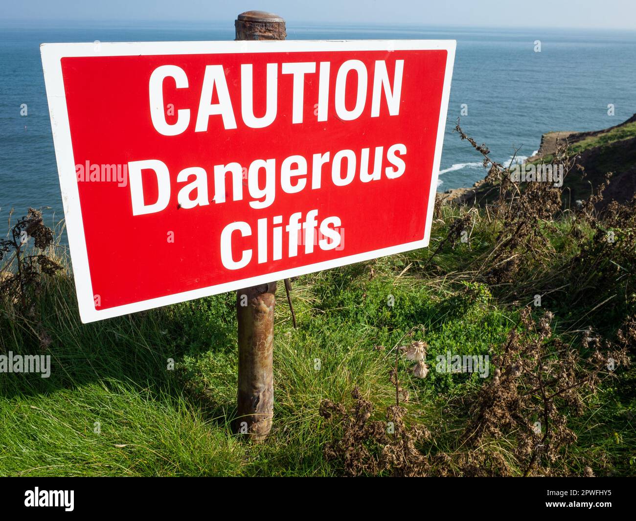 Warning Sign UK Dangerous Cliffs Coastal Erosion Stock Photo - Alamy