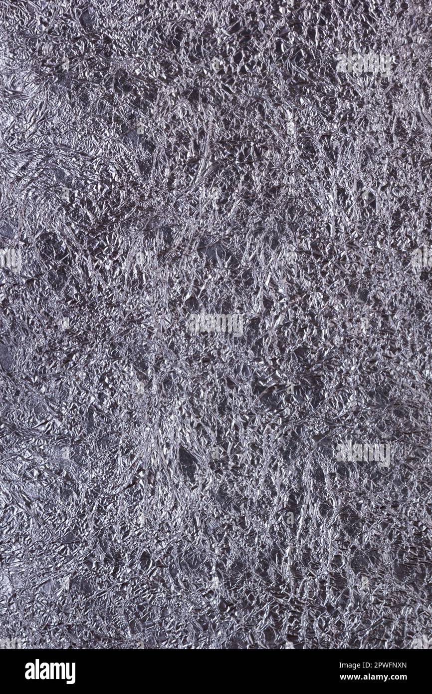 Shiny heavily wrinkled metal silver gray foil vertical texture ...