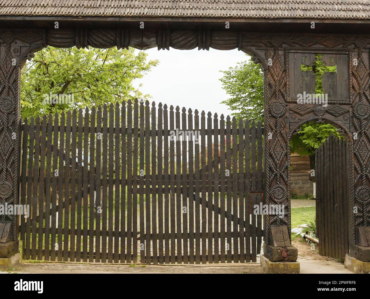 Old church gate made with dark oak wood in Alba Iulia , Romania Stock ...
