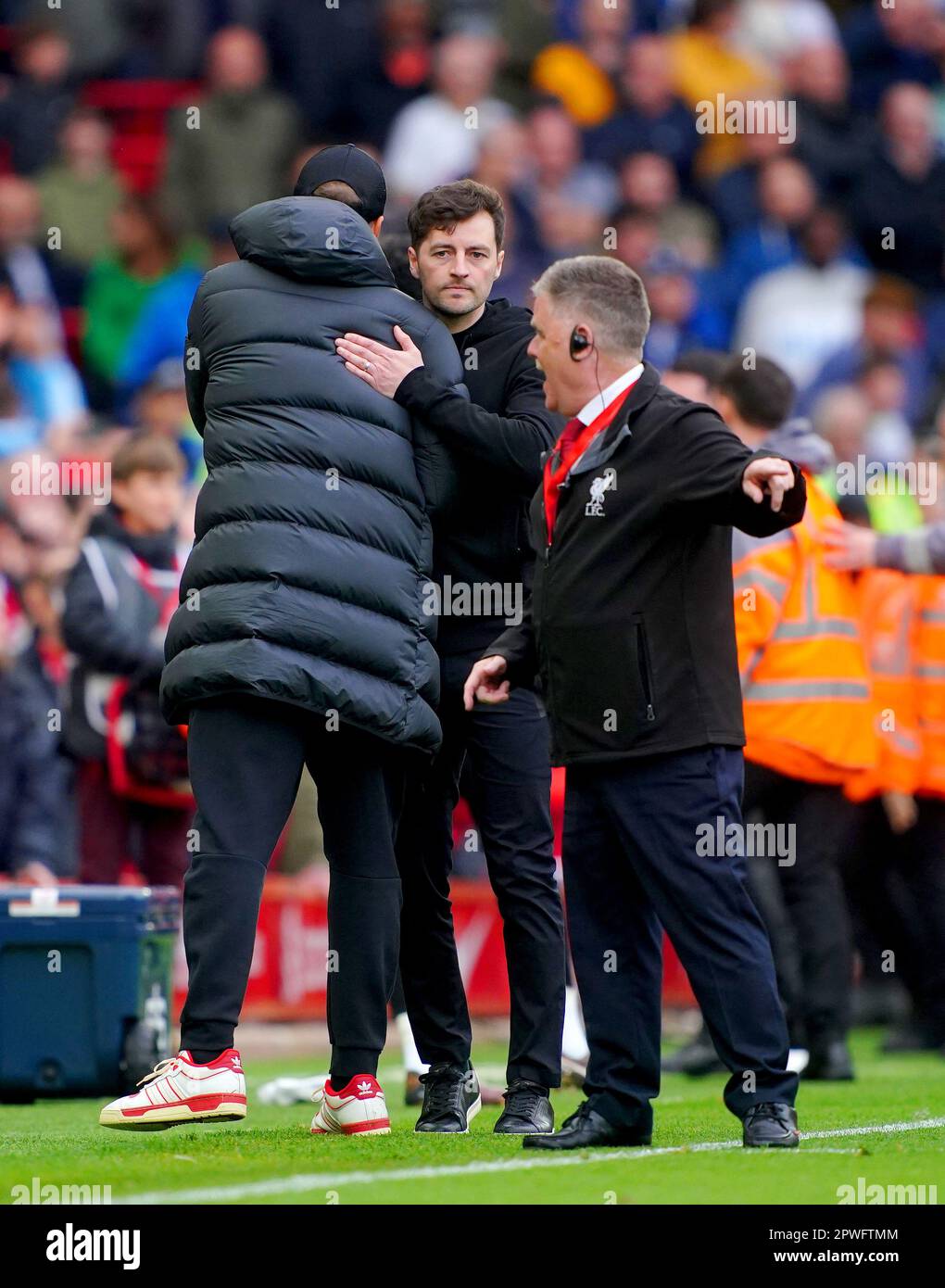 Liverpool manager Jurgen Klopp hugs Tottenham Hotspur acting head coach ...