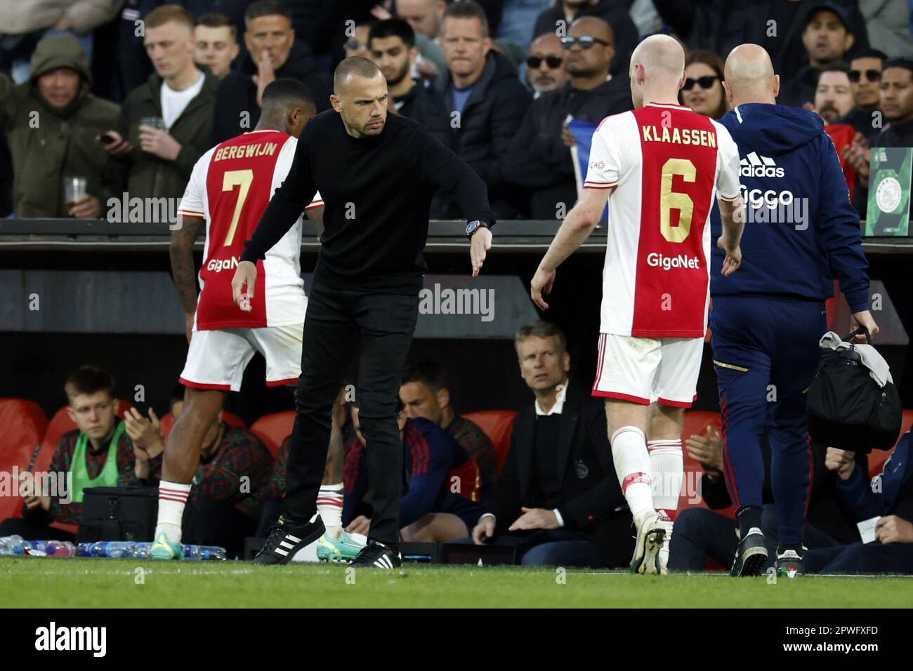 ROTTERDAM - (lr) Steven Bergwijn of Ajax, Ajax coach John Heitinga, Davy Klaassen of Ajax during ...