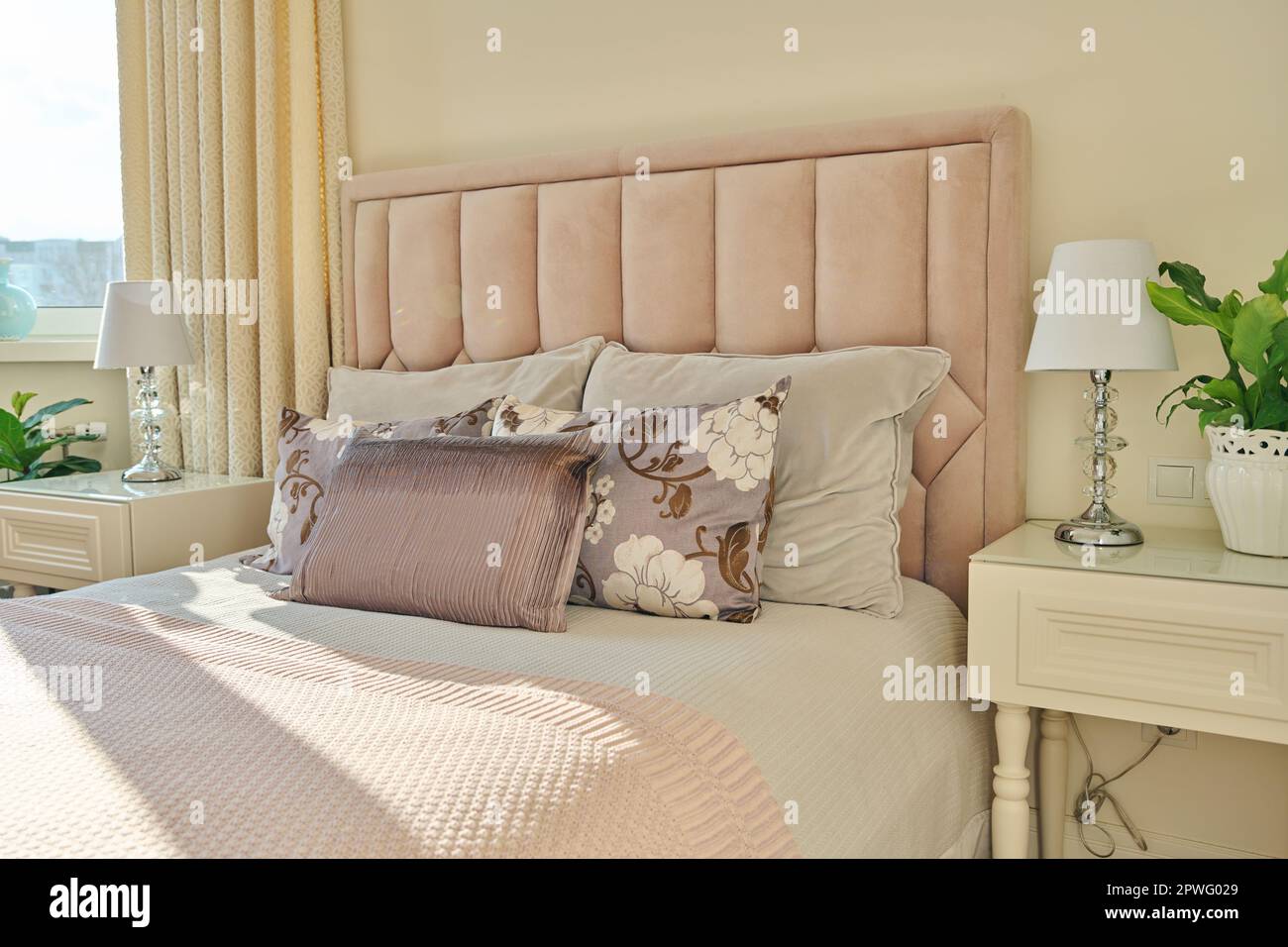 Classic bedroom interior in light ivory colors, in warm sunlight Stock ...
