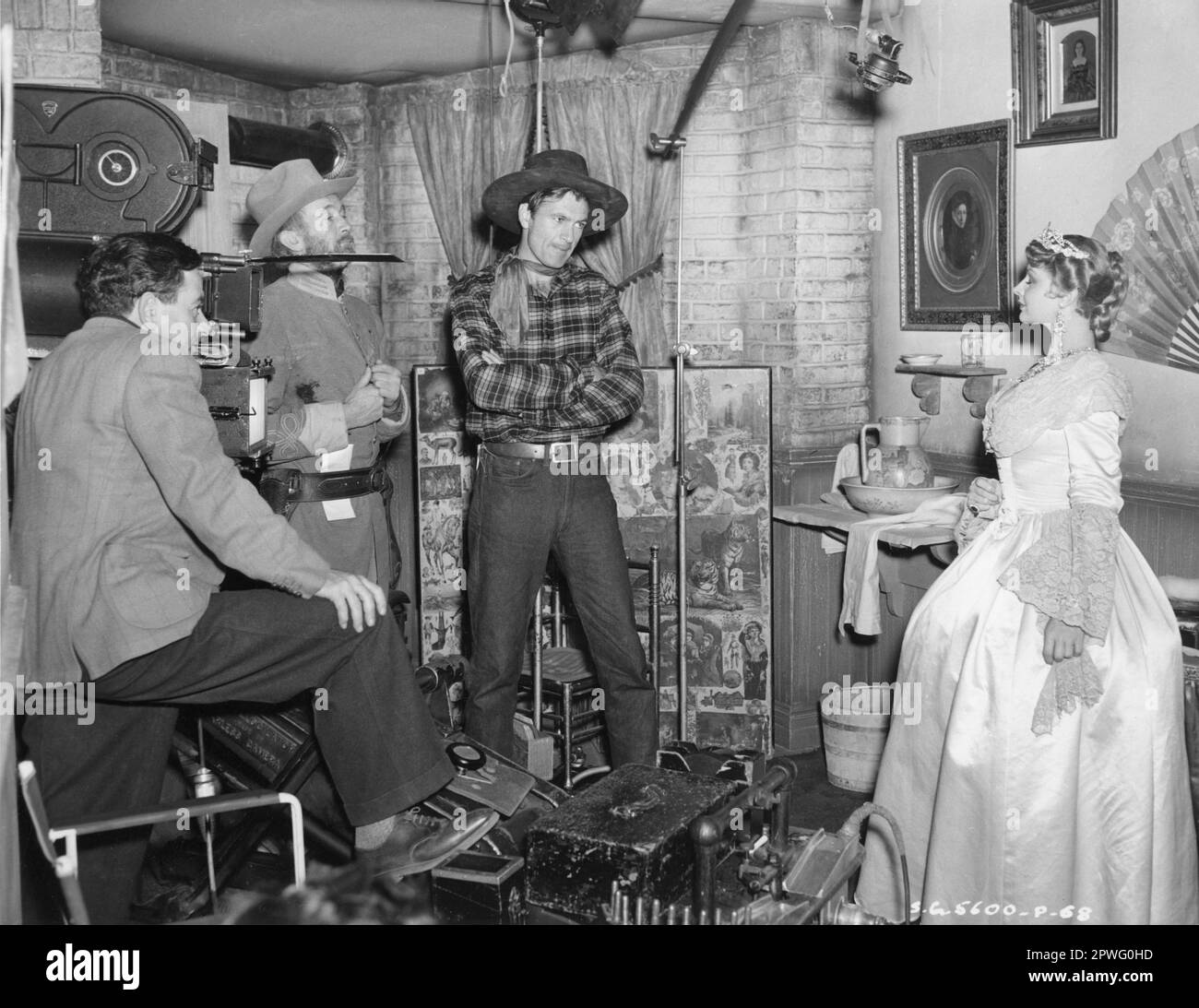 WILLIAM WYLER filming a scene with WALTER BRENNAN, GARY COOPER and ...