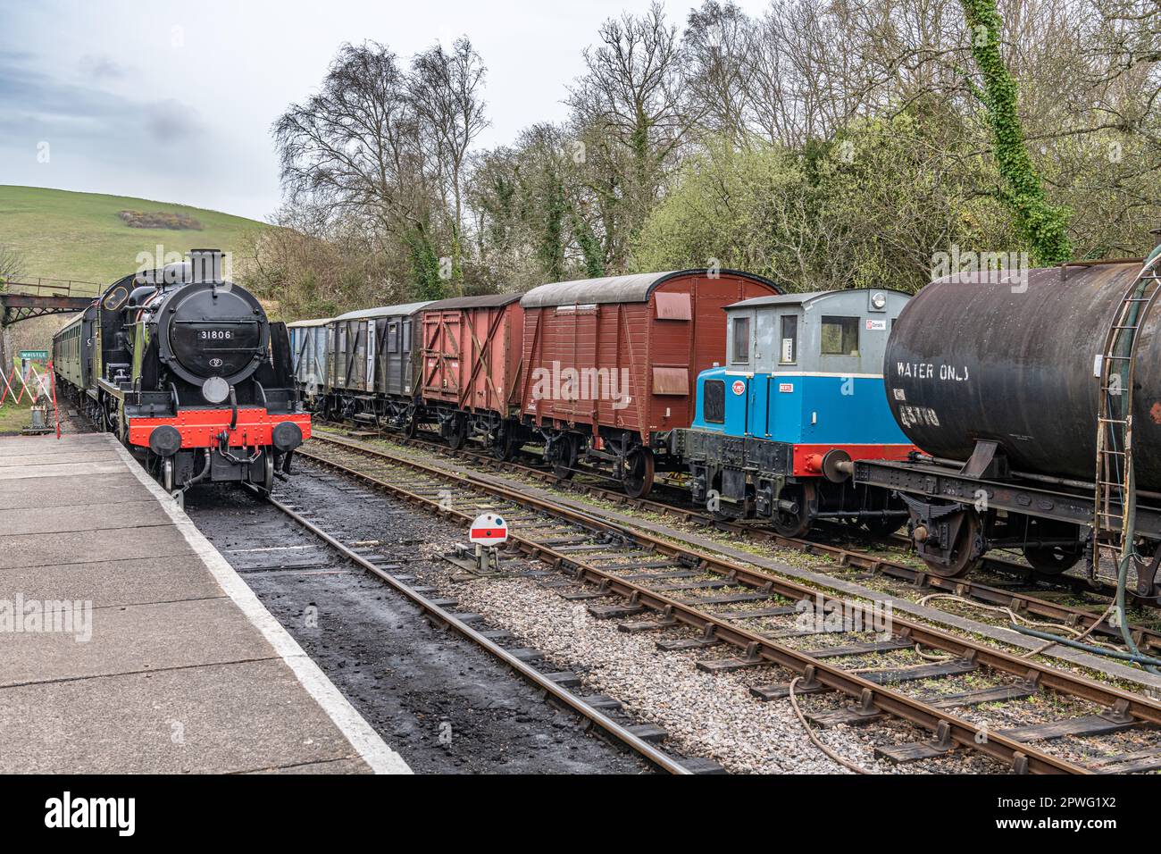Steam Locomotive arriving at Norden station passing Old Goods Wagons on ...