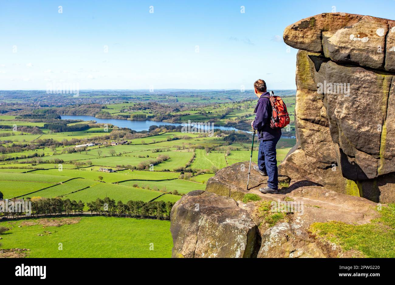 Man looking over Tittesworth reservoir walking backpacking on Hen Cloud ...