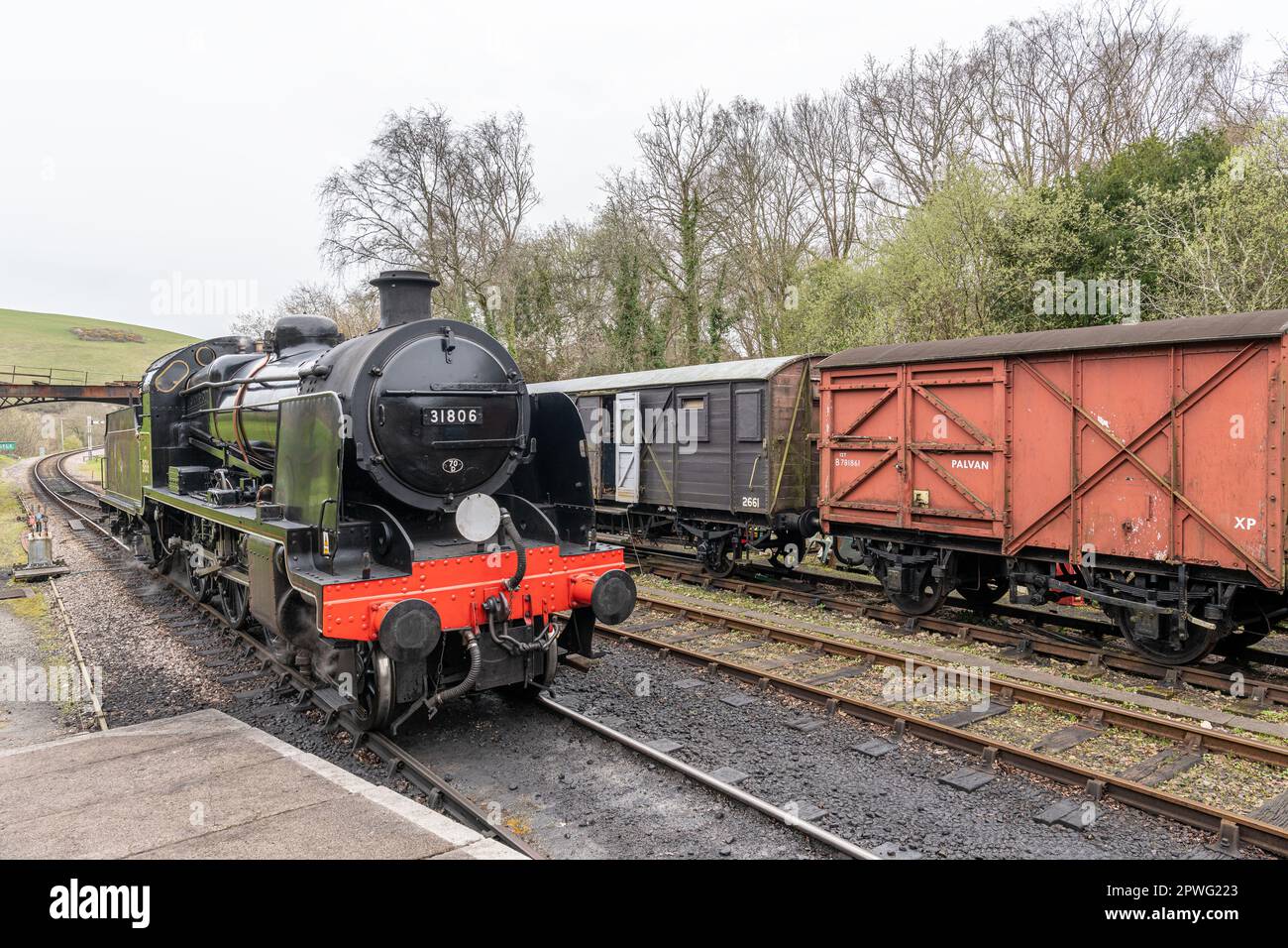 Steam Locomotive arriving at Norden station passing Old Goods Wagons on ...