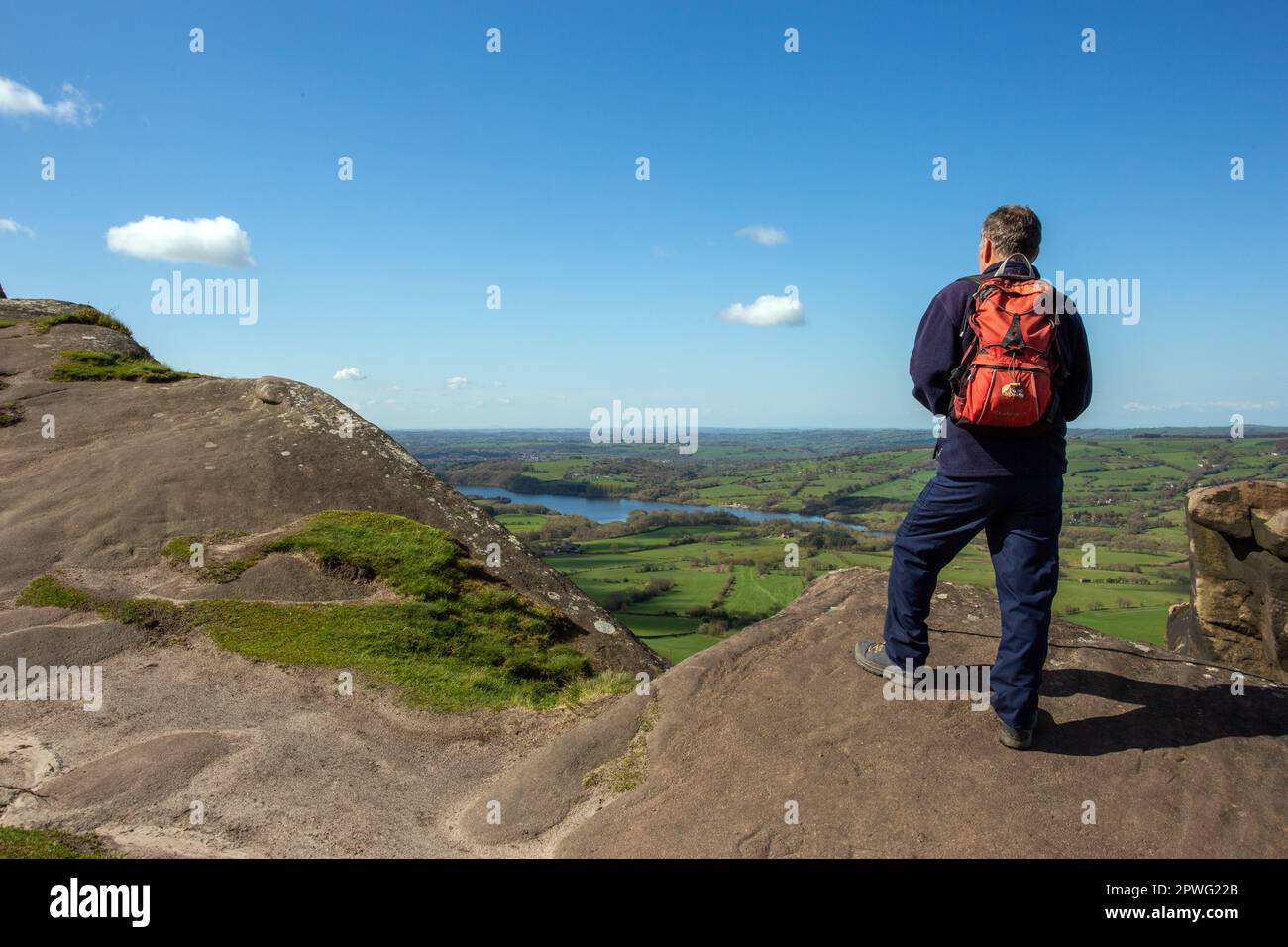 Man looking over Tittesworth reservoir walking backpacking on Hen Cloud ...