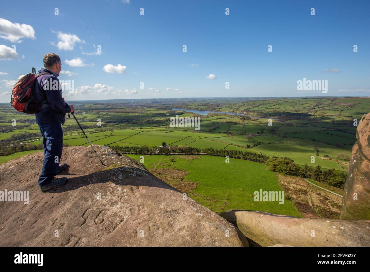 Man looking over Tittesworth reservoir walking backpacking on Hen Cloud ...