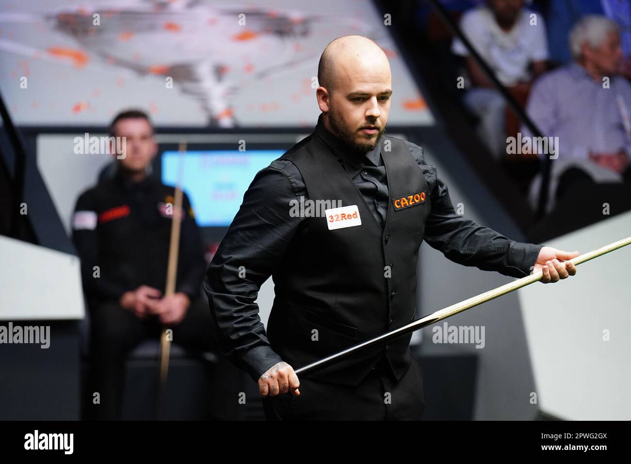 Luca Brecel in action against Mark Selby (left) during the final on day ...
