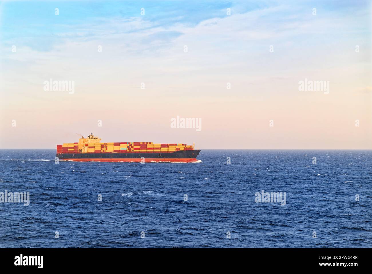 Panoramic view of large cargo container ship sailing in open sea on ...