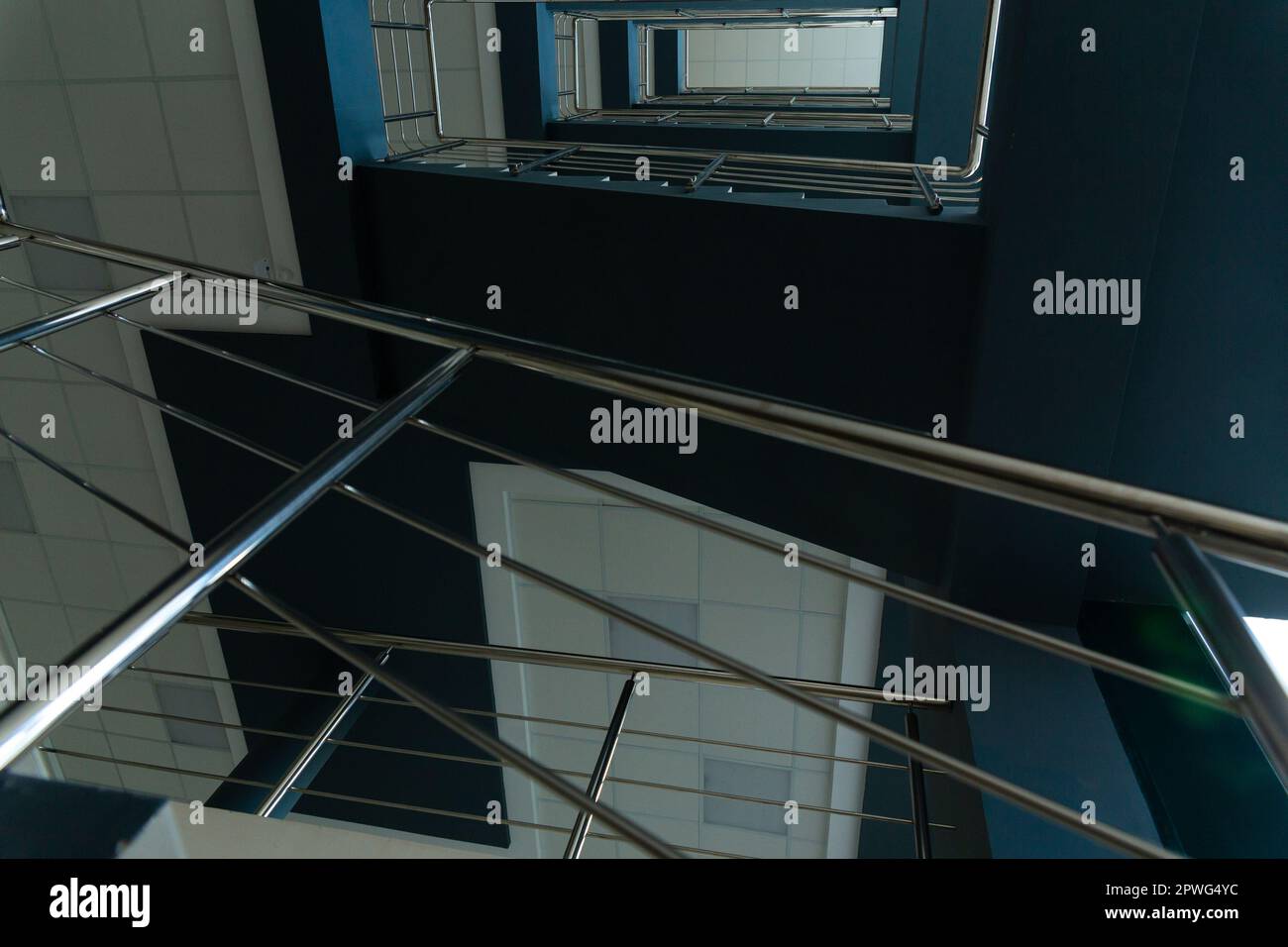 Stairs in a concrete office building in neutral tones, covered with ...