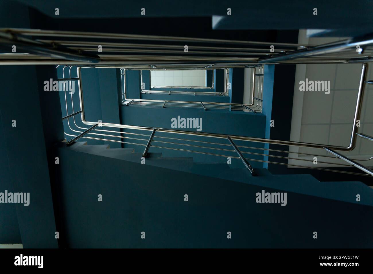 Stairs in a concrete office building in neutral tones, covered with ...