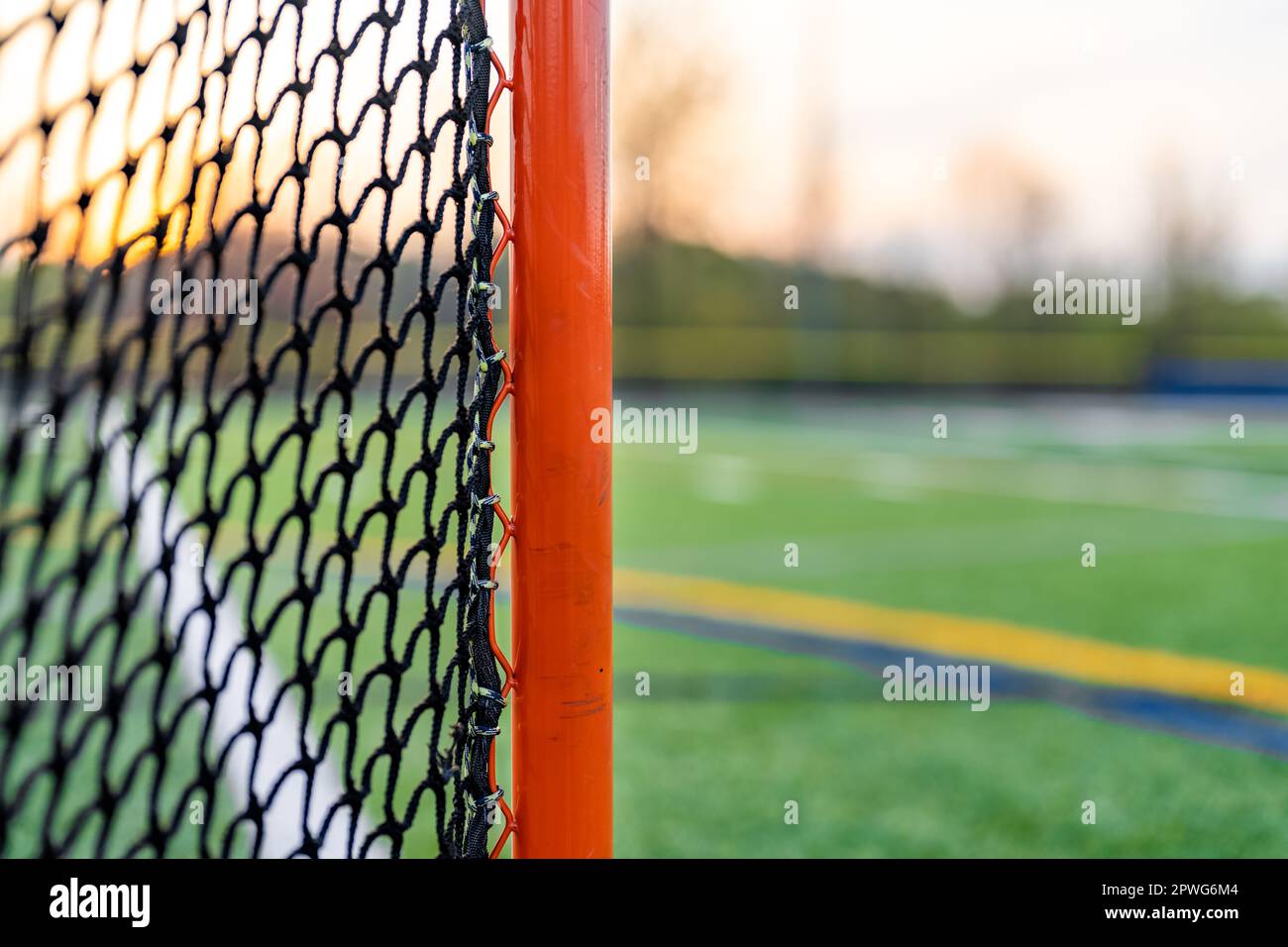Late afternoon photo of a lacrosse goal on a synthetic turf field ...