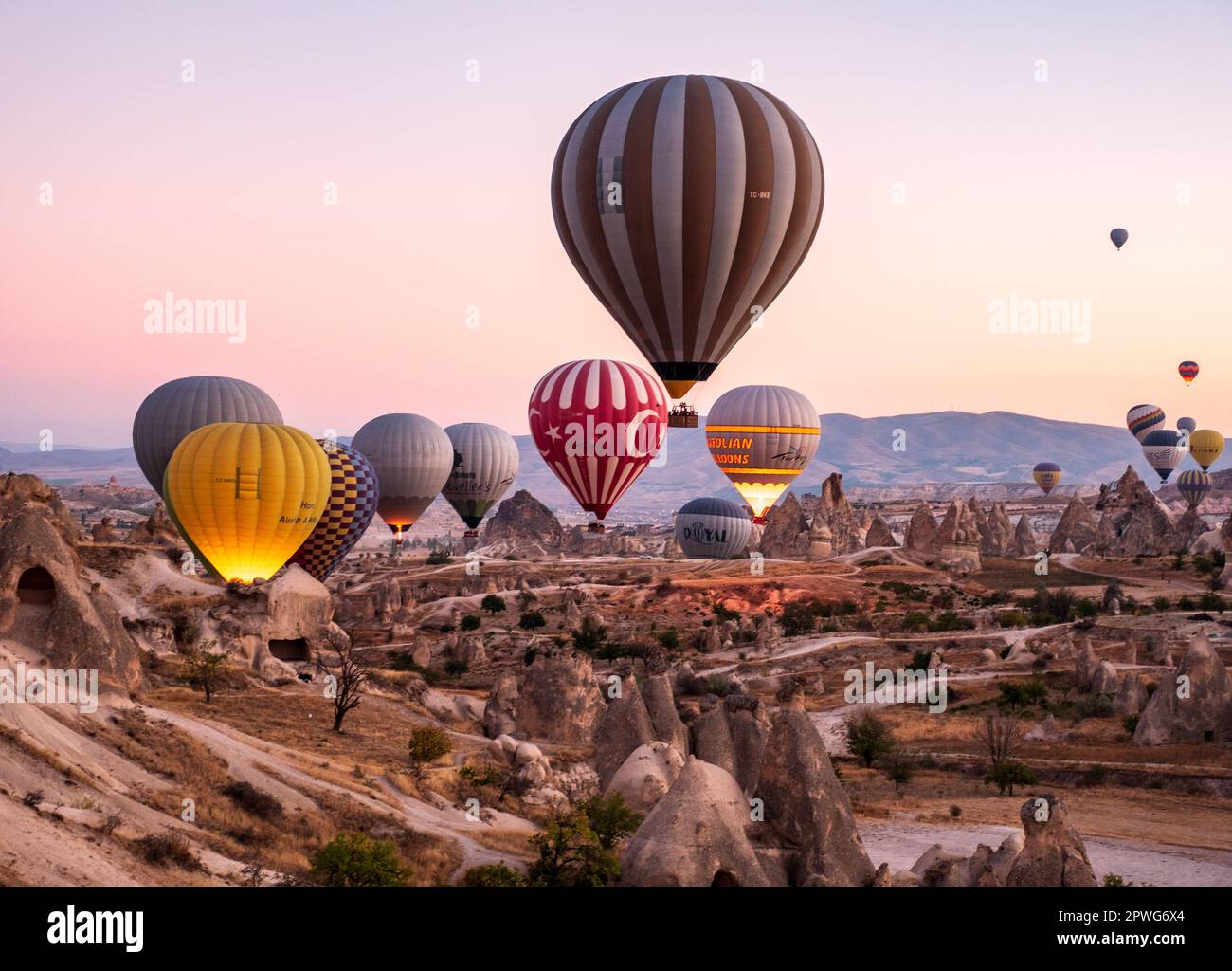 Hot air balloons, at sunrise Cappadocia Turkey. Photographed air to air ...