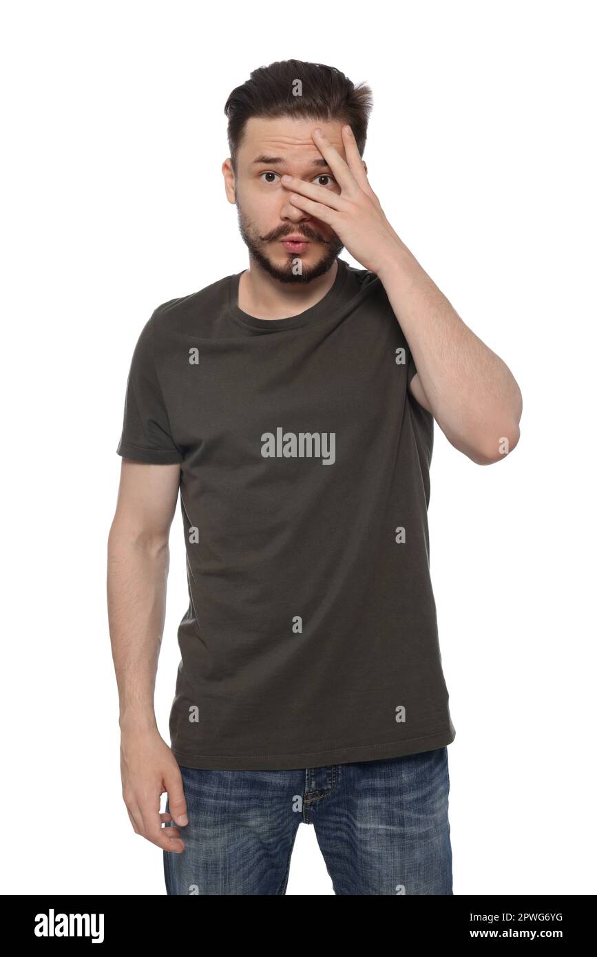 Embarrassed man covering face with hand on white background Stock Photo ...