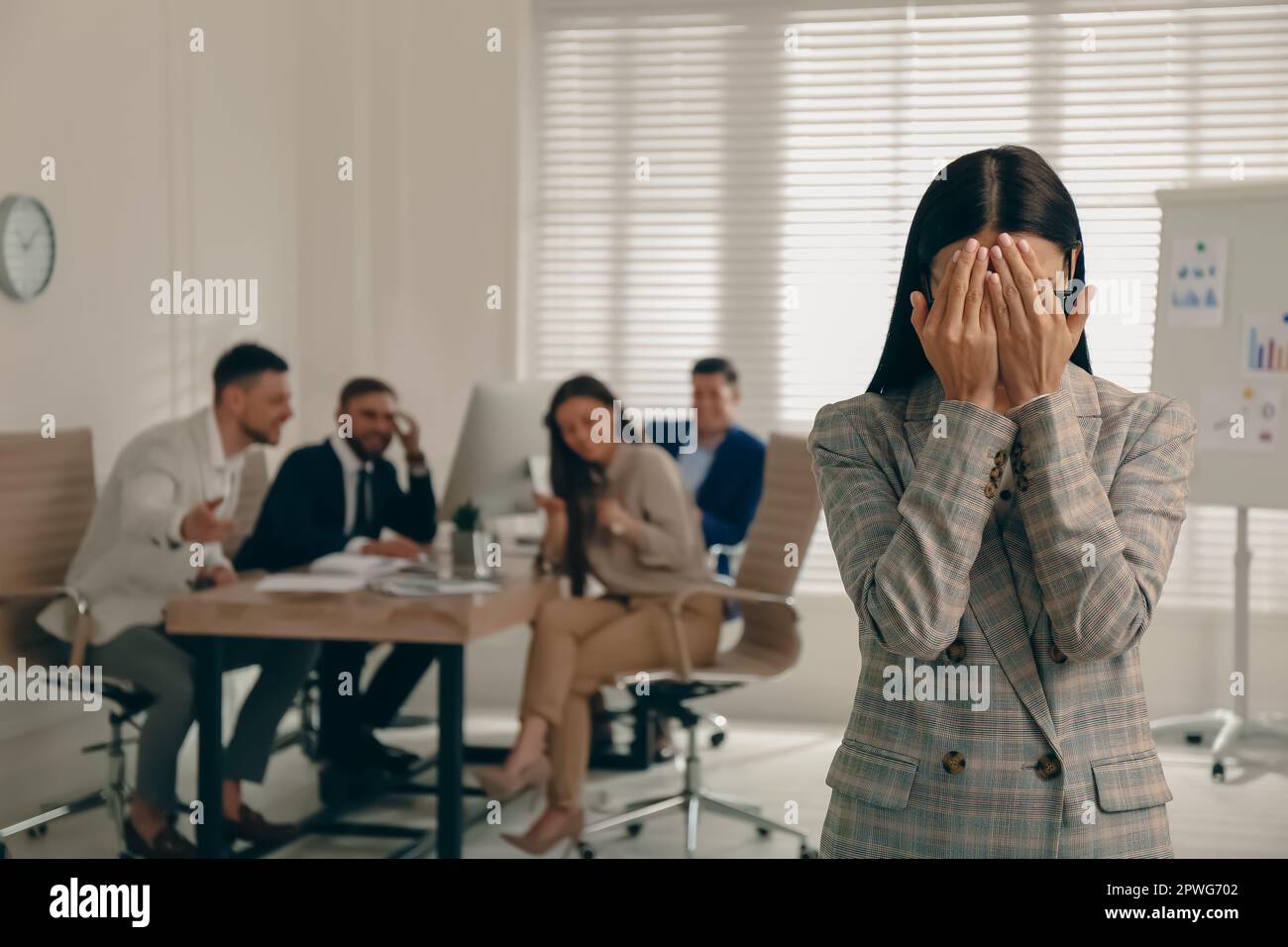 Woman suffering from toxic environment at work Stock Photo - Alamy