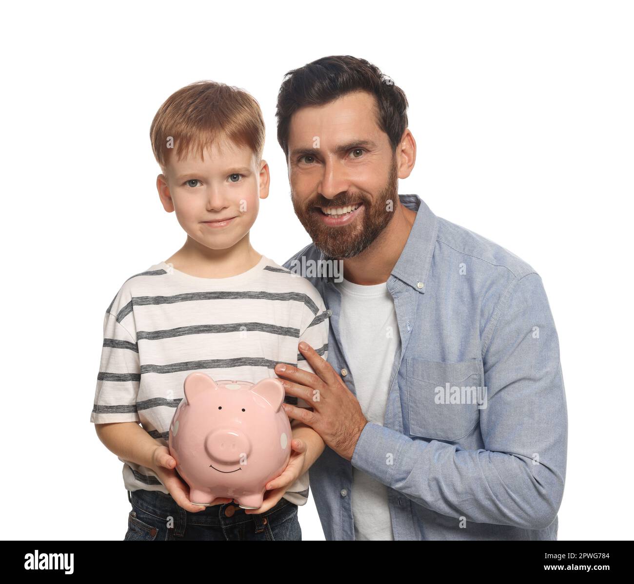 Father and his son with ceramic piggy bank on white background Stock ...