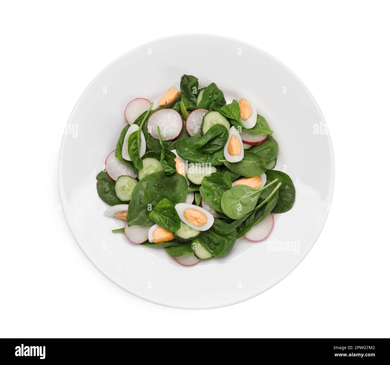 Delicious salad with boiled eggs, radish and spinach isolated on white ...