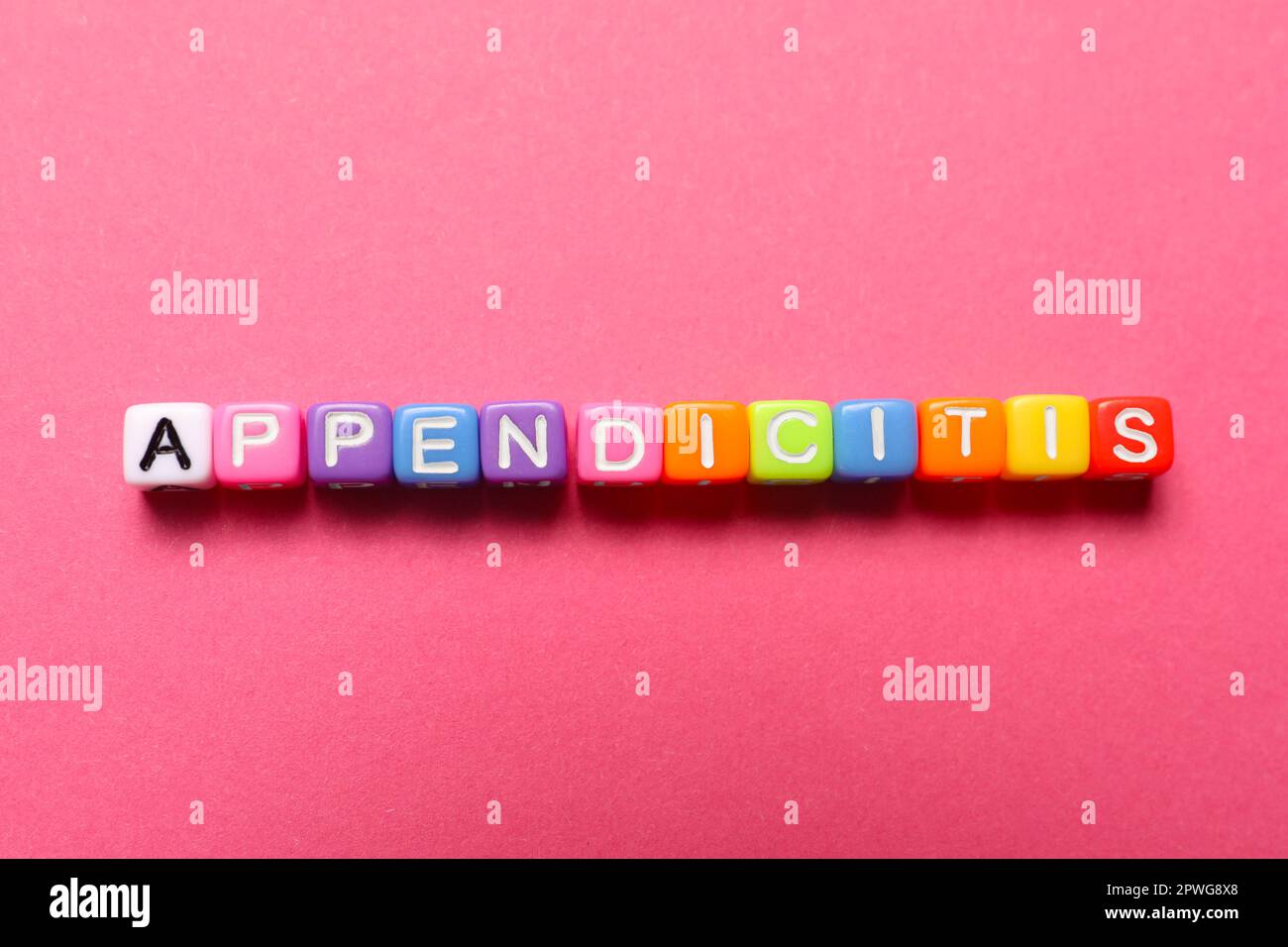 Word Appendicitis made of color cubes with letters on pink background ...