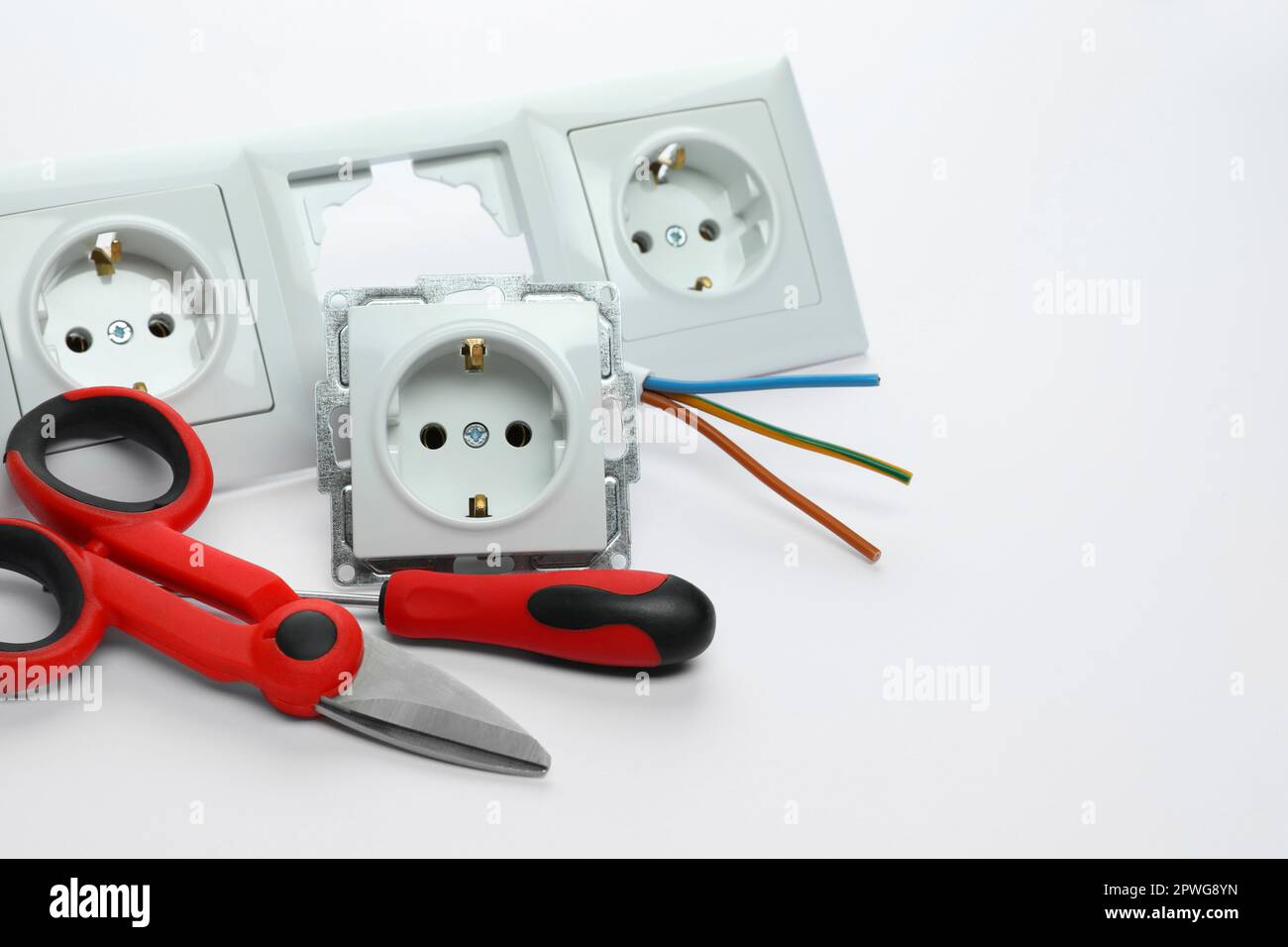 Set of sockets and electrician's tools on white background Stock Photo ...