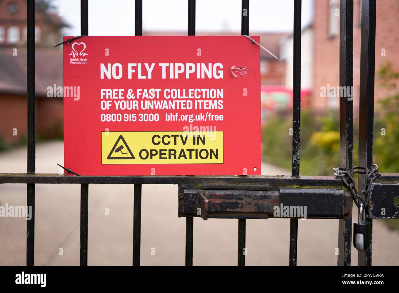 Red no fly tipping sign on metal gate Stock Photo - Alamy