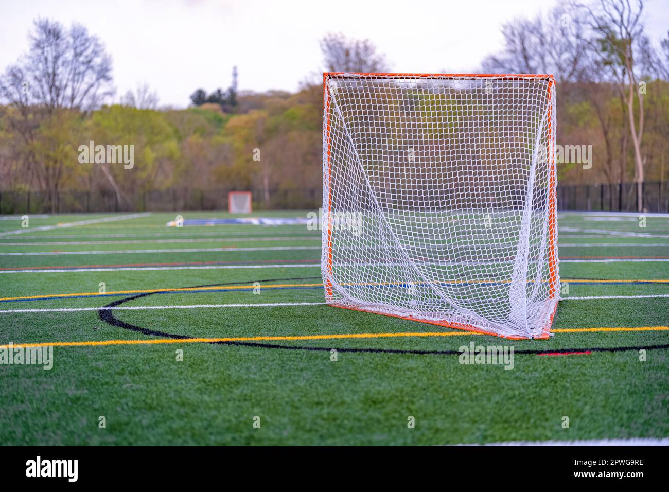 Late afternoon photo of a lacrosse goal on a synthetic turf field ...