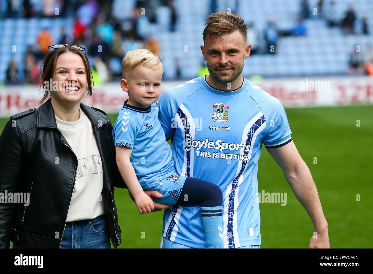 Coventry City's Matthew Godden and his family on the pitch at the end ...