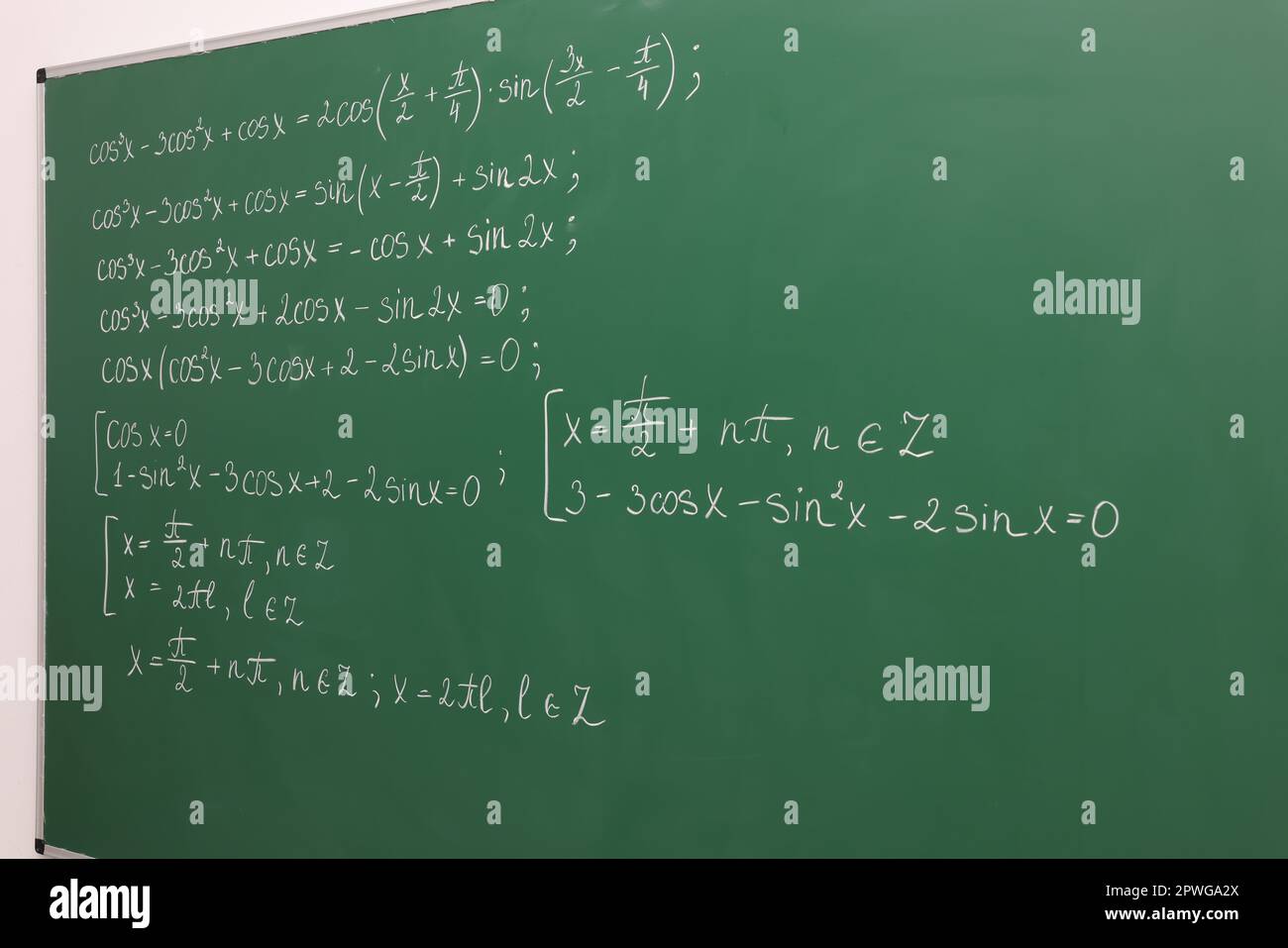 Many different math formulas written on green chalkboard Stock Photo - Alamy