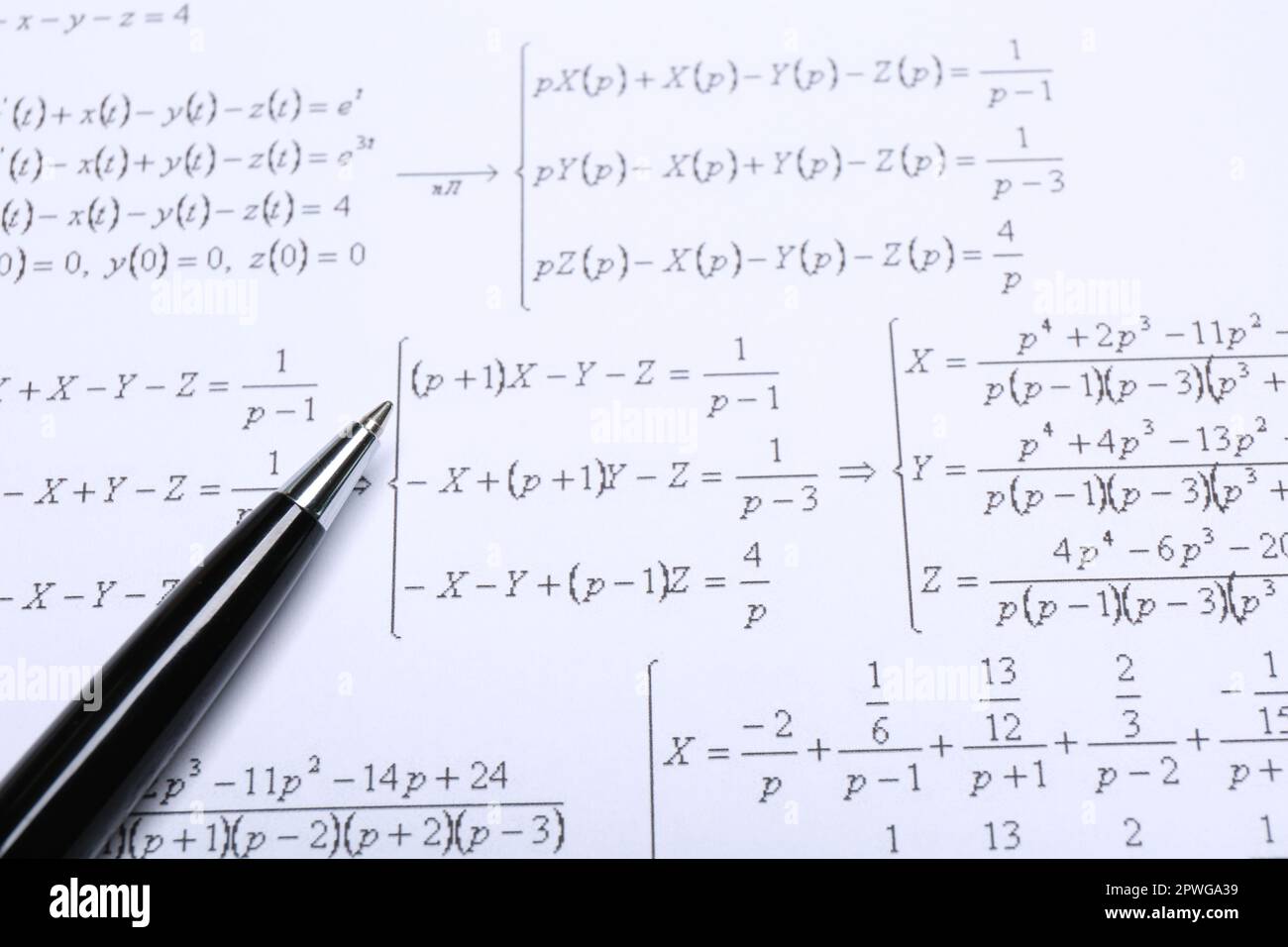 Sheet of paper with mathematical formulas and pen, closeup Stock Photo ...