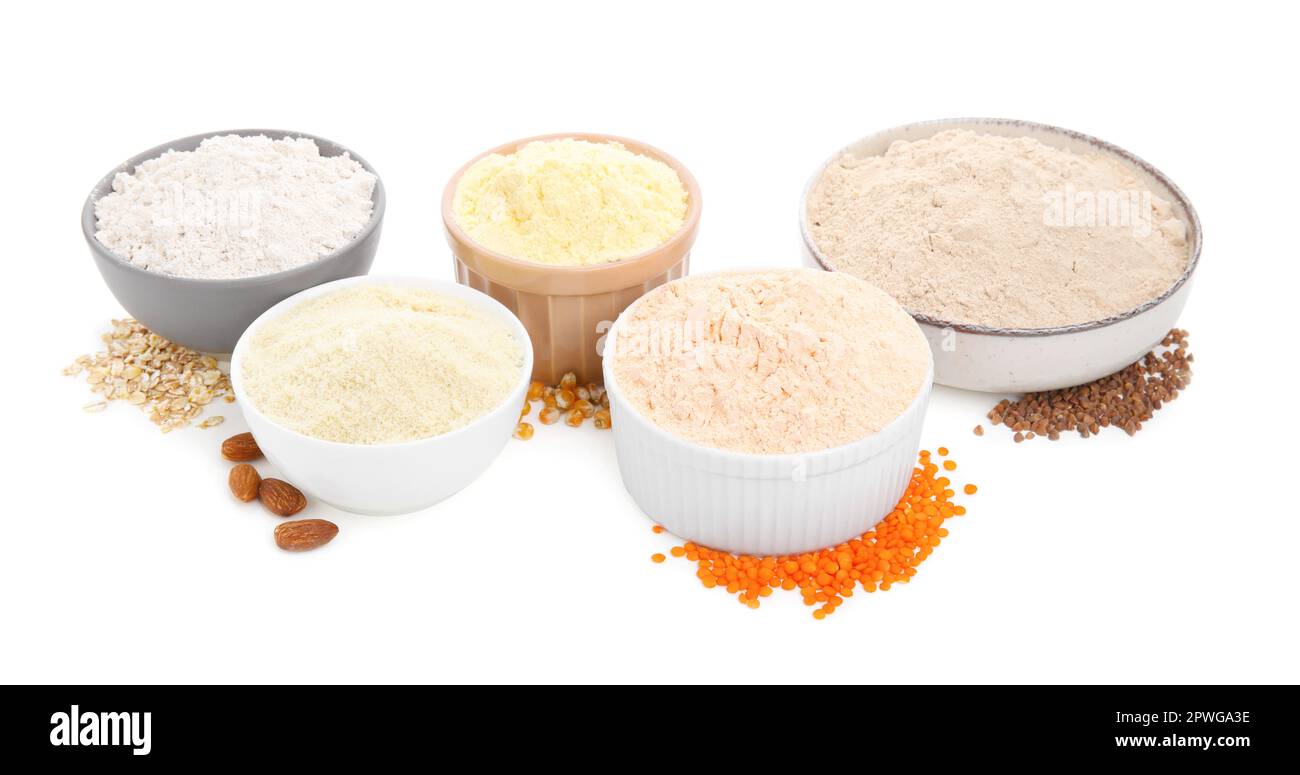 Different types of flour in bowls on white background Stock Photo - Alamy