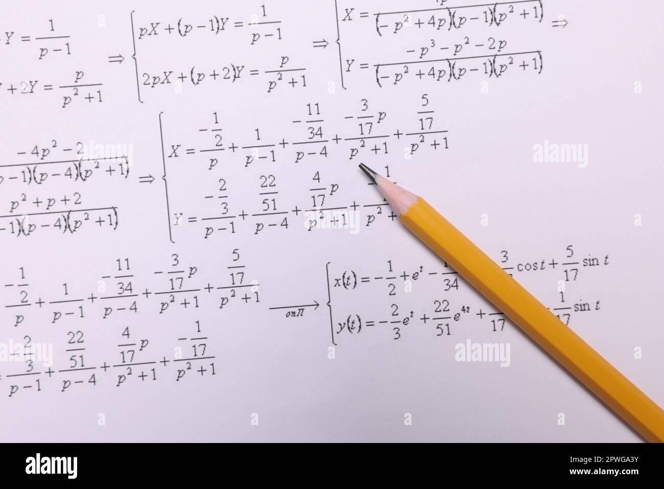 Sheet of paper with mathematical formulas and pencil, top view Stock ...