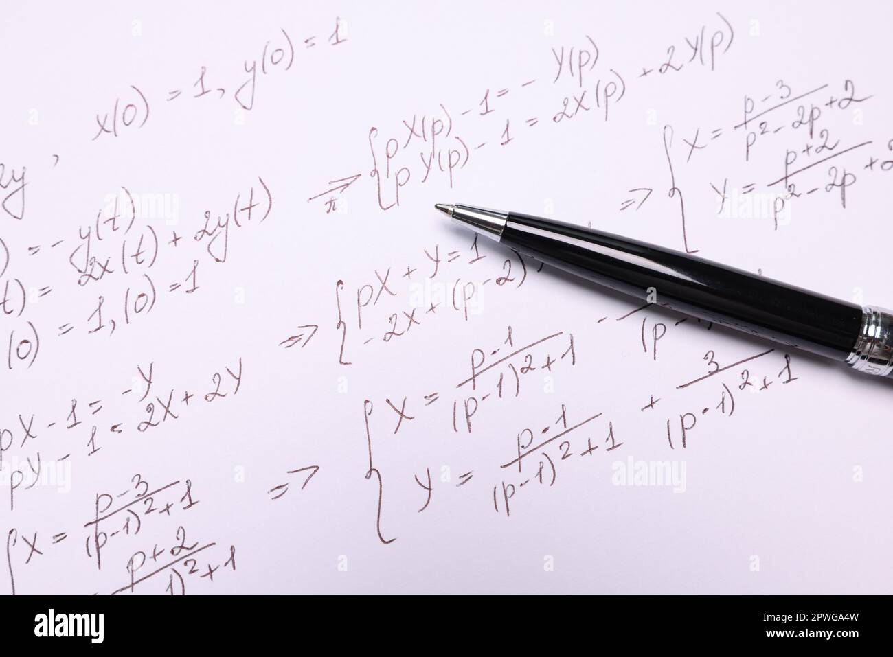 Sheet of paper with mathematical formulas and pen, closeup Stock Photo ...
