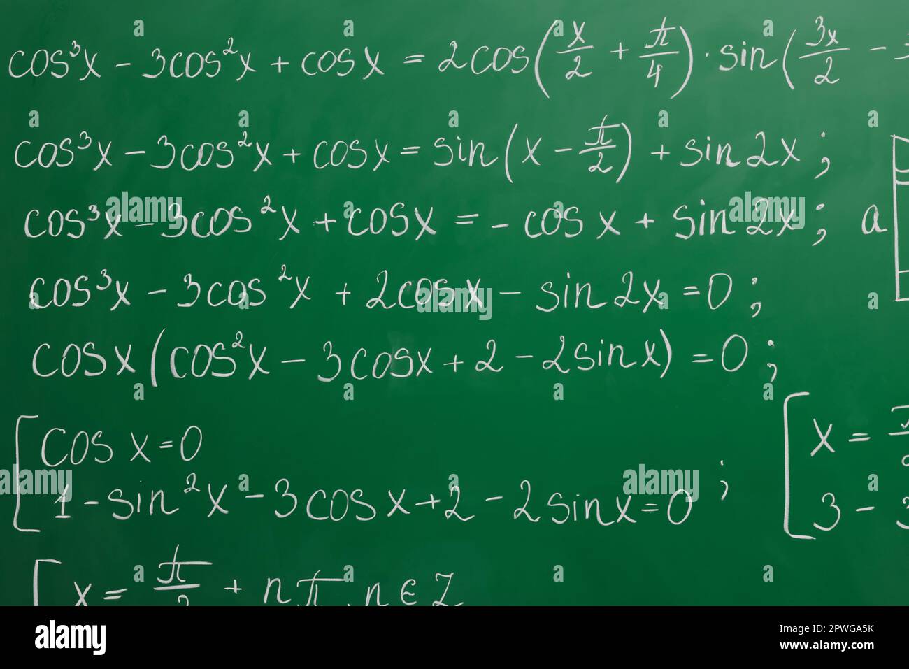 Many different math formulas written on green chalkboard Stock Photo - Alamy