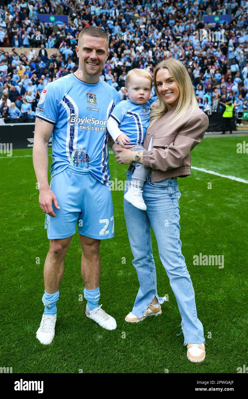 Coventry City's Jake Bidwell and his family on the pitch at the end of ...