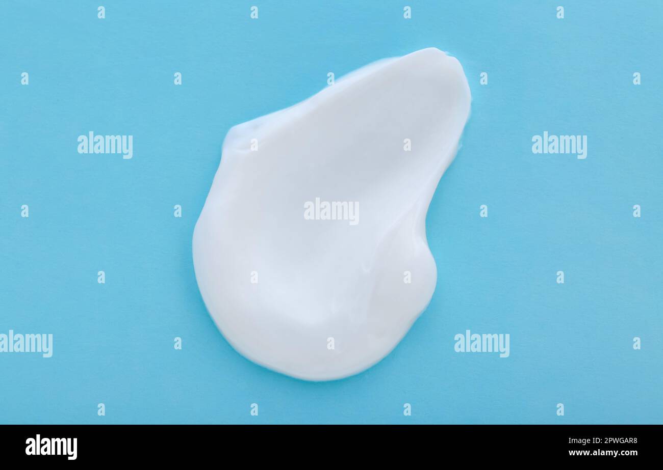 Sample of body cream on light blue background, top view Stock Photo - Alamy