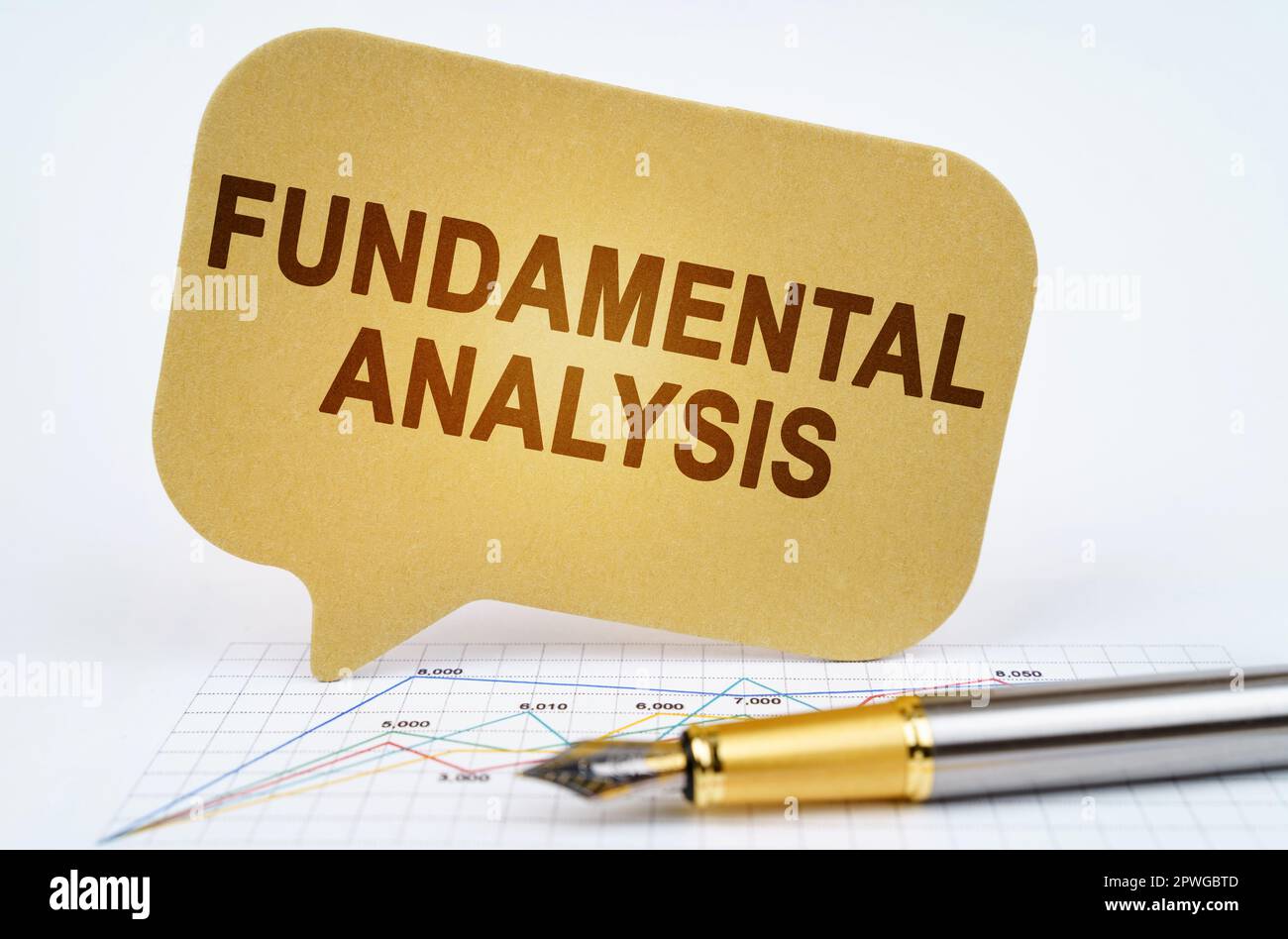 Business concept. On the business diagram is a pen and a sign with the ...