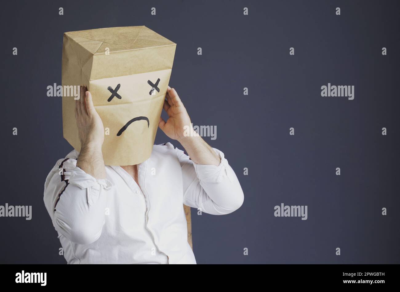 Sad man with a bag on his head, with a drawn crying emoticon Stock ...