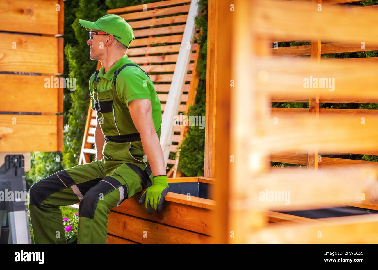 Caucasian Man in His 40s and His Garden Woodwork Project Seating on ...