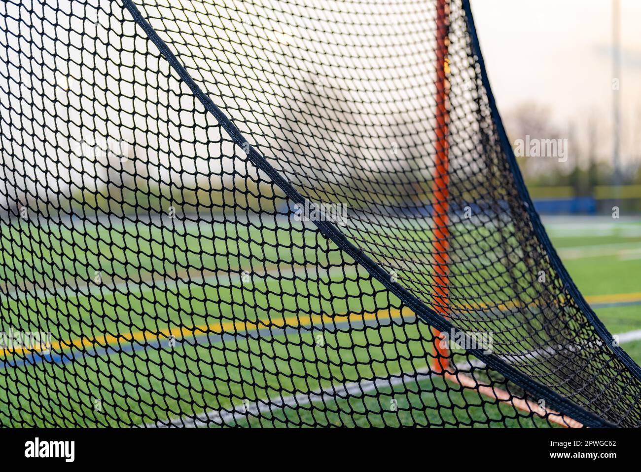 Late afternoon photo of a lacrosse goal on a synthetic turf field ...
