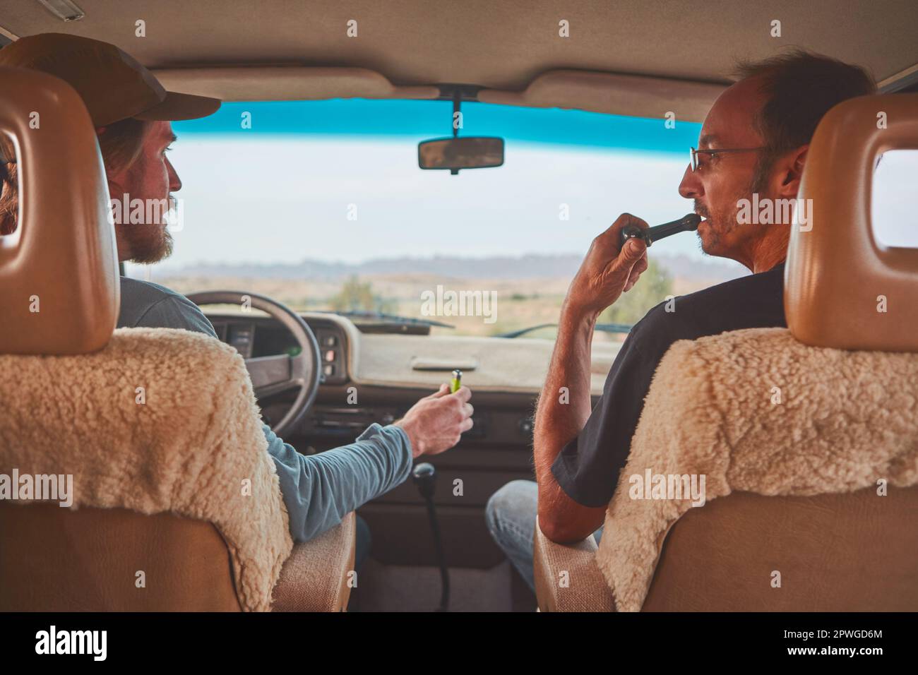This road trip couldnt get any better. two men smoking together while ...